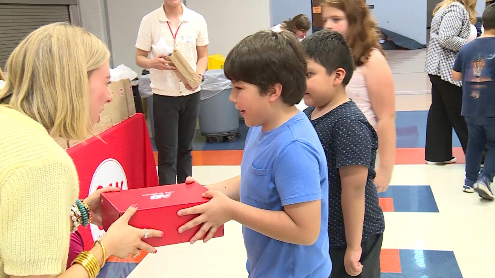 'I love them': Elementary school students receive sneakers for upcoming ...