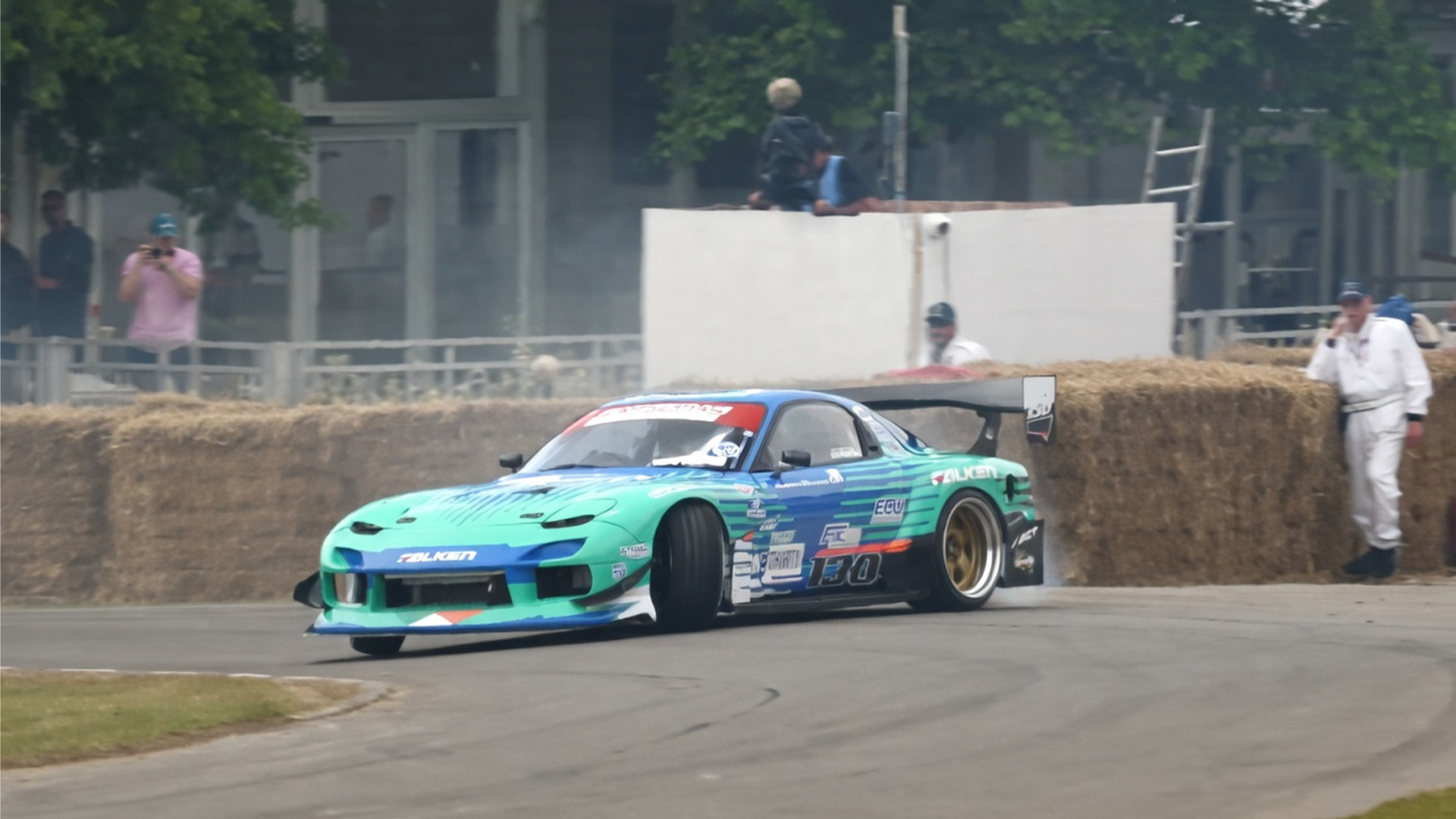 Mazda RX7 nearly slips out of control on circuit corner