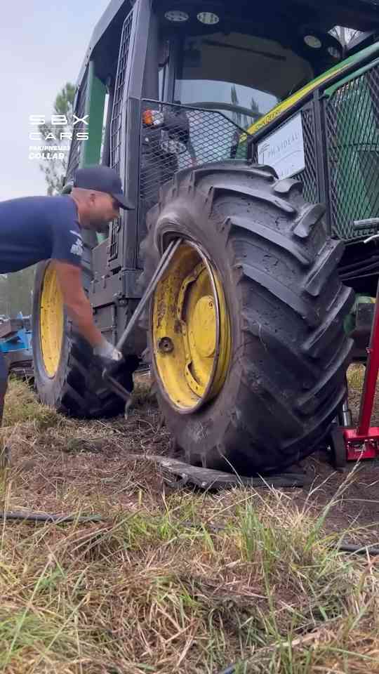 They changed this massive tire like it was nothing
