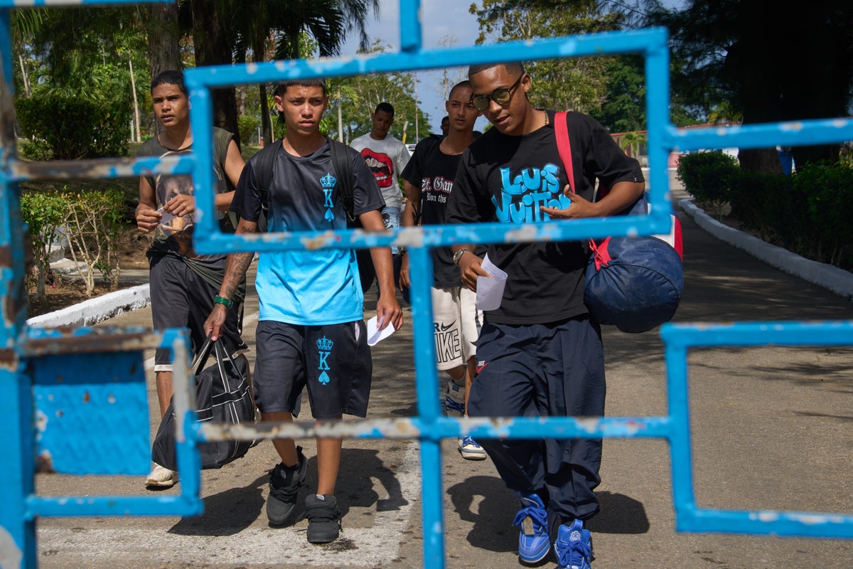 Photos of freed prisoners reuniting with families outside a Cuban prison
