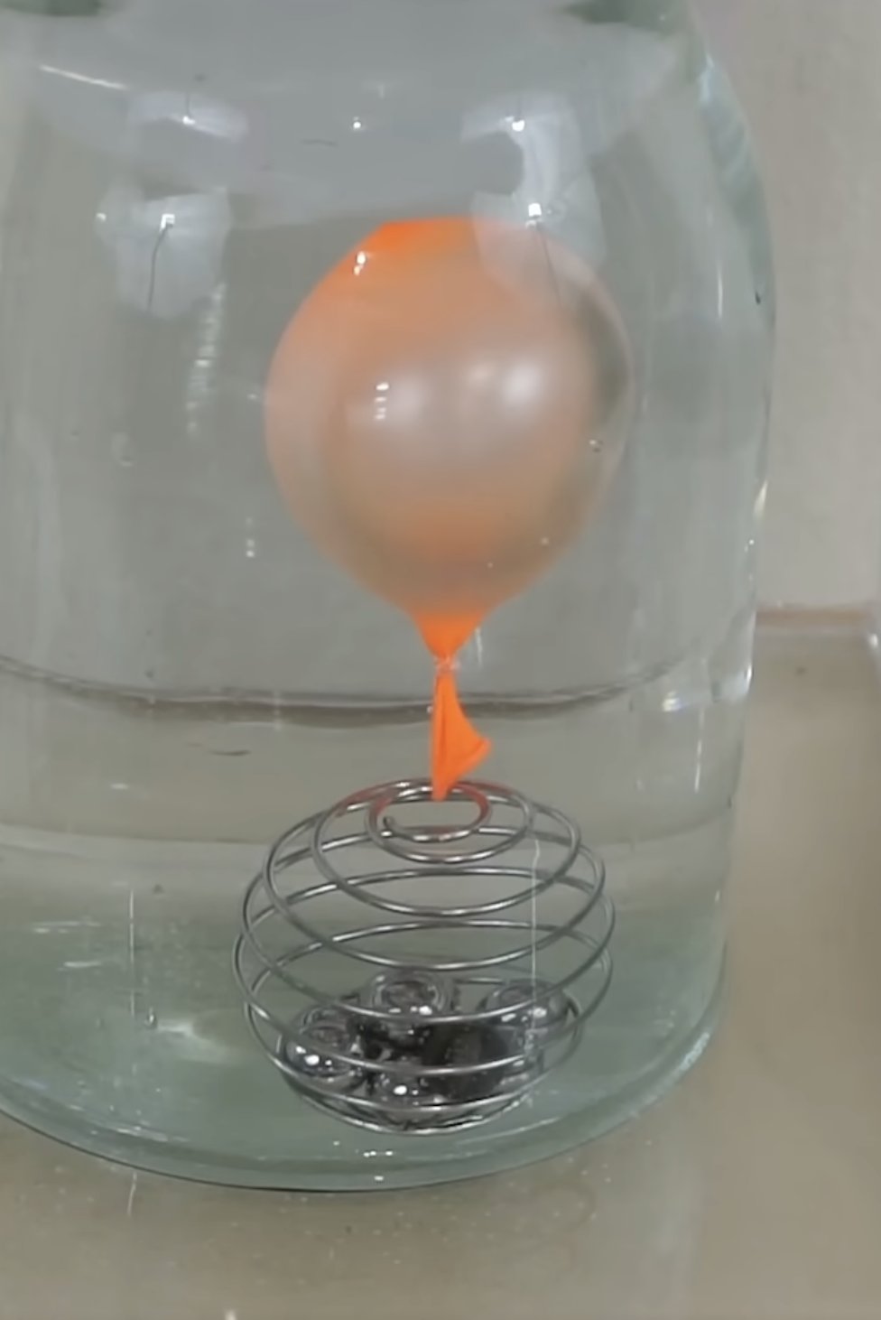Tiny balloon lifting heavy weights