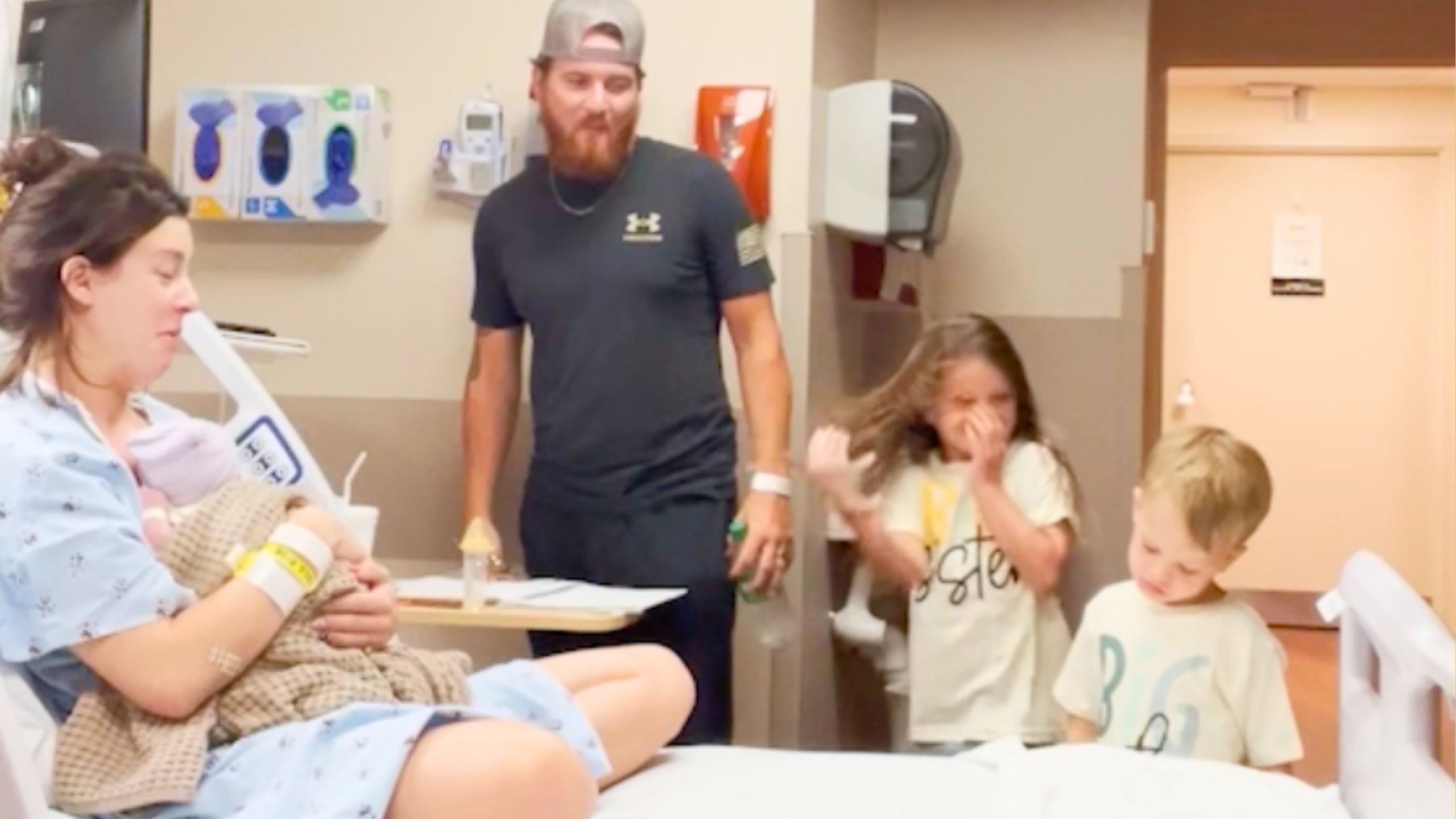 Boy looks devastated when he discovers newborn sibling is another ...