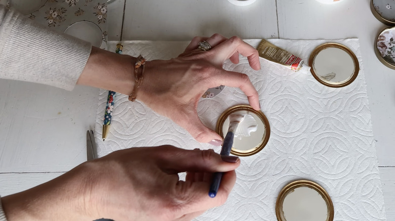 Repurpose lids from old glass jars into charming kitchen decor
