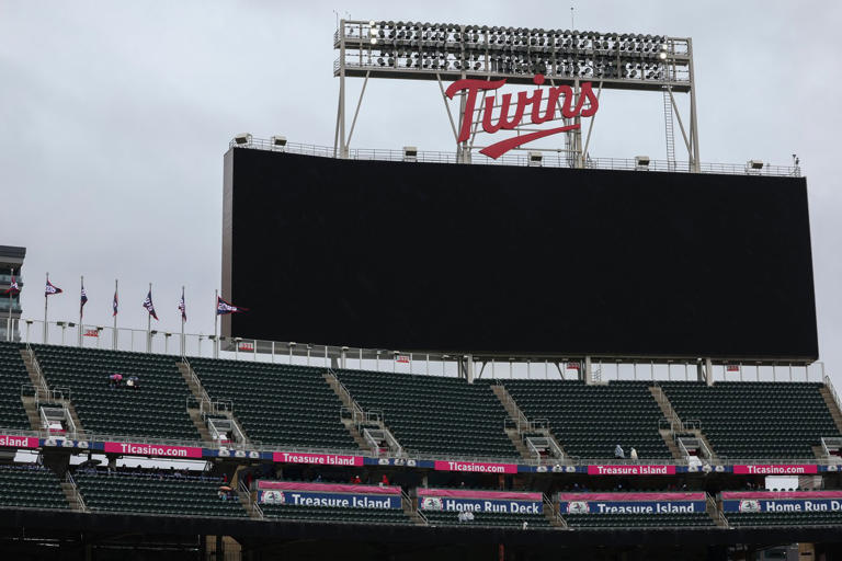 Twins endure a pregame power outage on a cold, rainy day to make for a ...