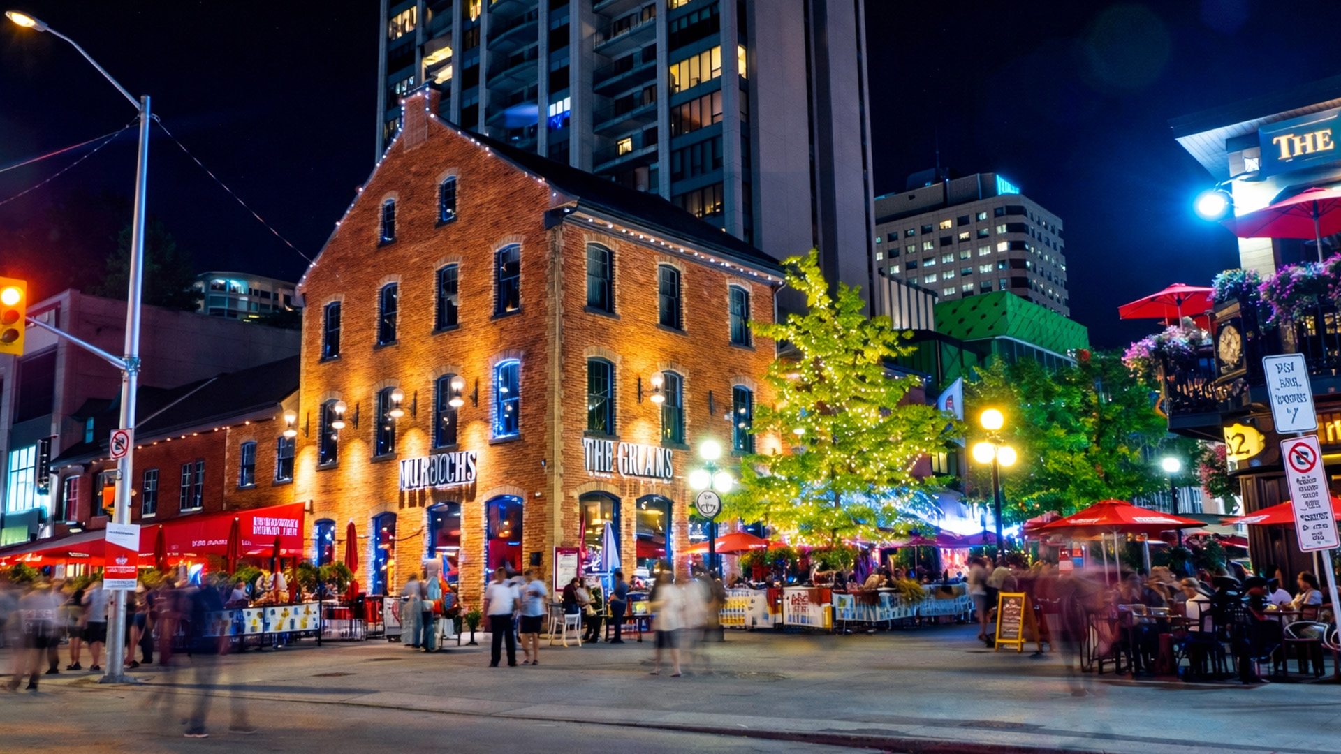 A night city scene with lights and historic buildings