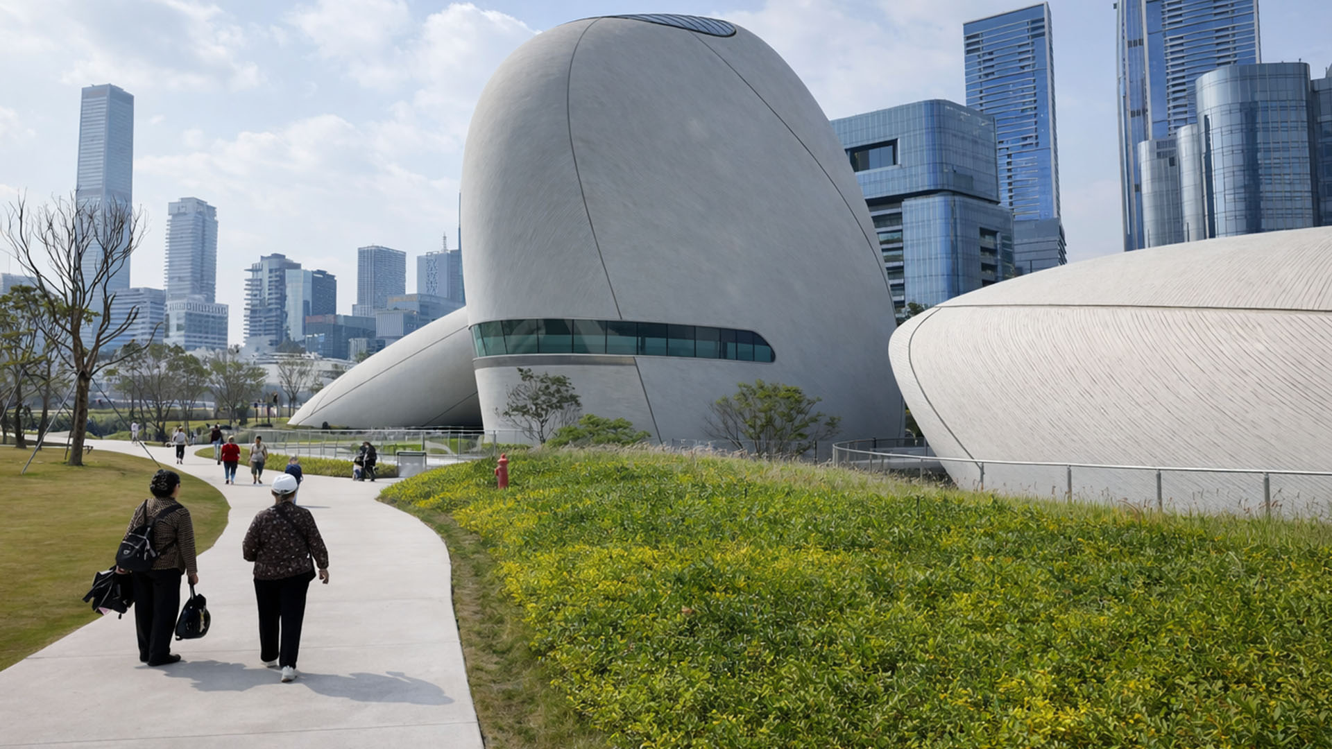 Distinct curved building in China attracts visitors in open green space