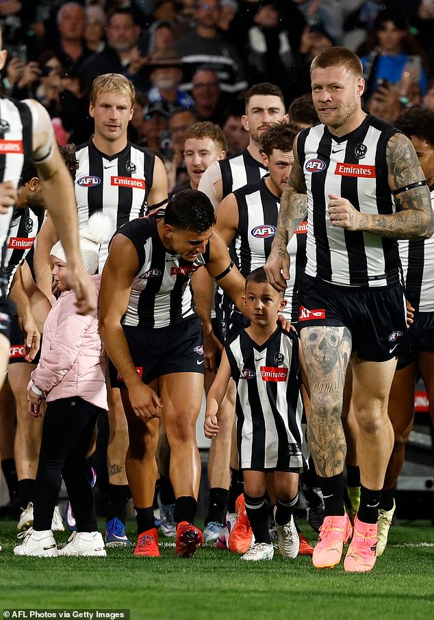 Tex Walker's son runs out with Collingwood star Nick Daicos in Magpies ...