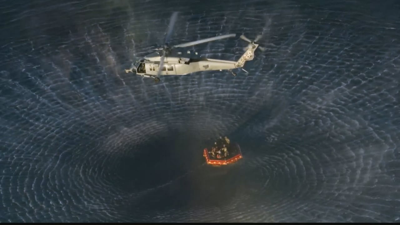 Artemis II crew exit capsule after returning to Earth