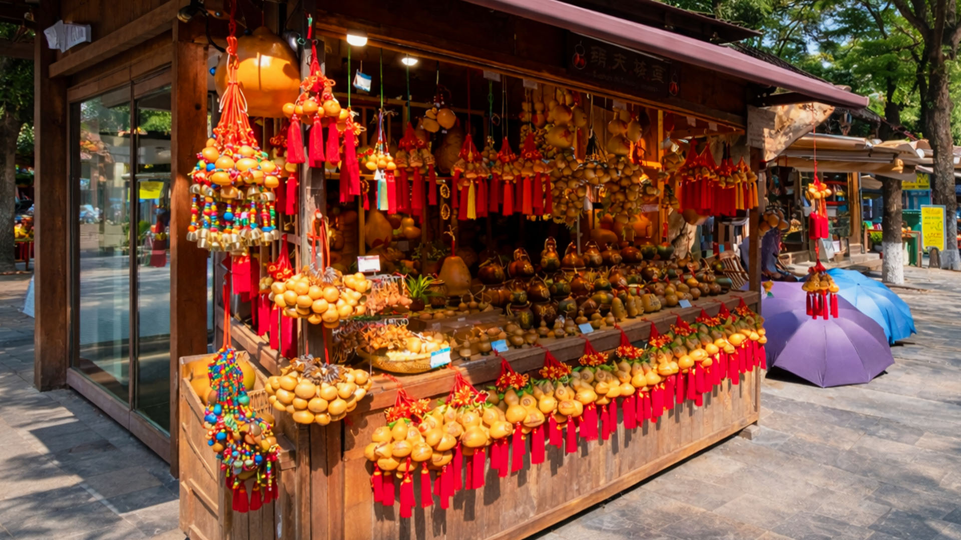 Colorful market booth selling handmade cultural souvenirs in outdoor area