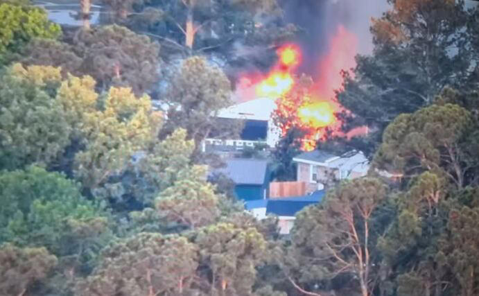 Fire crews battle large structure fire on Kings Chapel Road