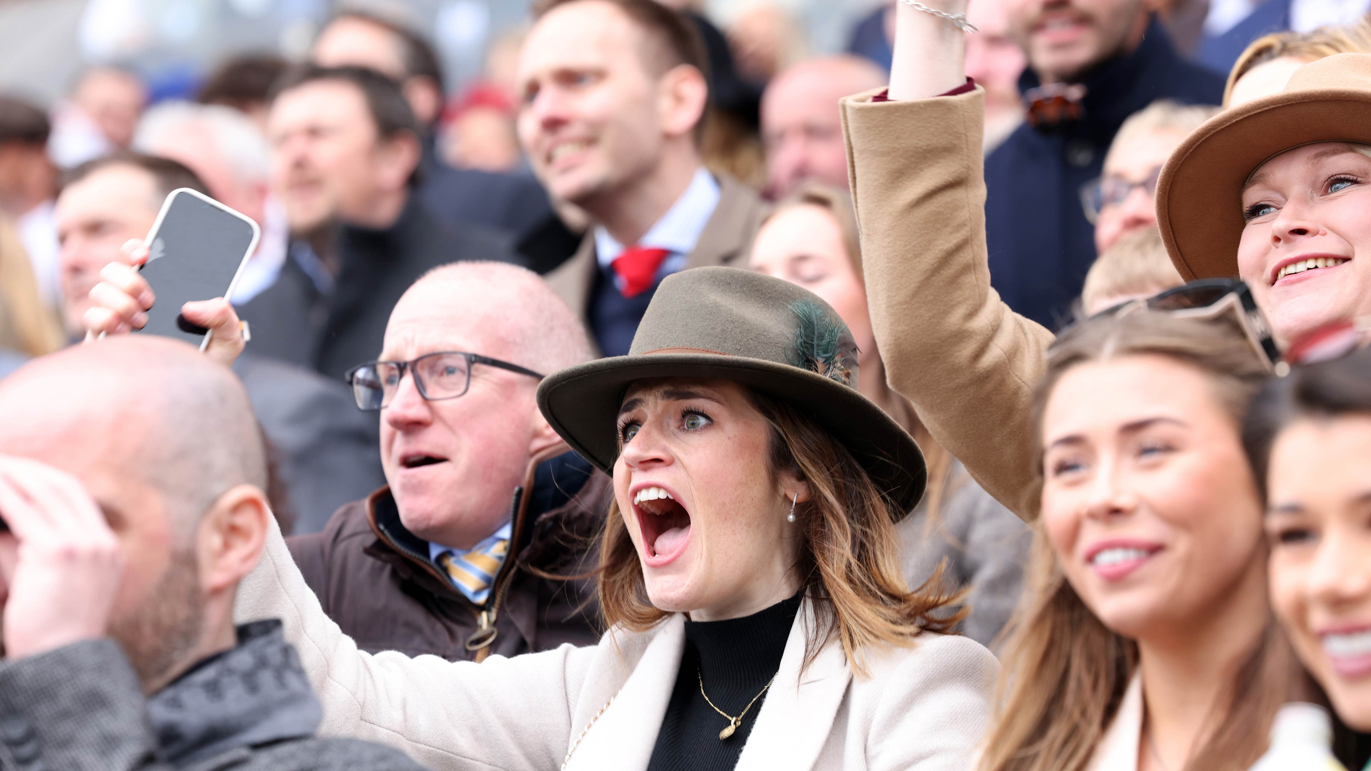 Crowds cheer on as Grand National winner crosses the line