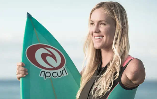 She lost an arm in a shark attack but returned to become a professional ...