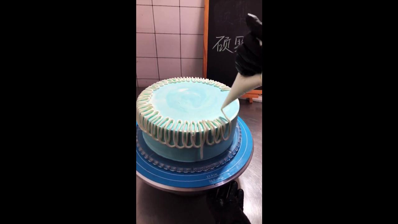 Making blue cake theme icing cake