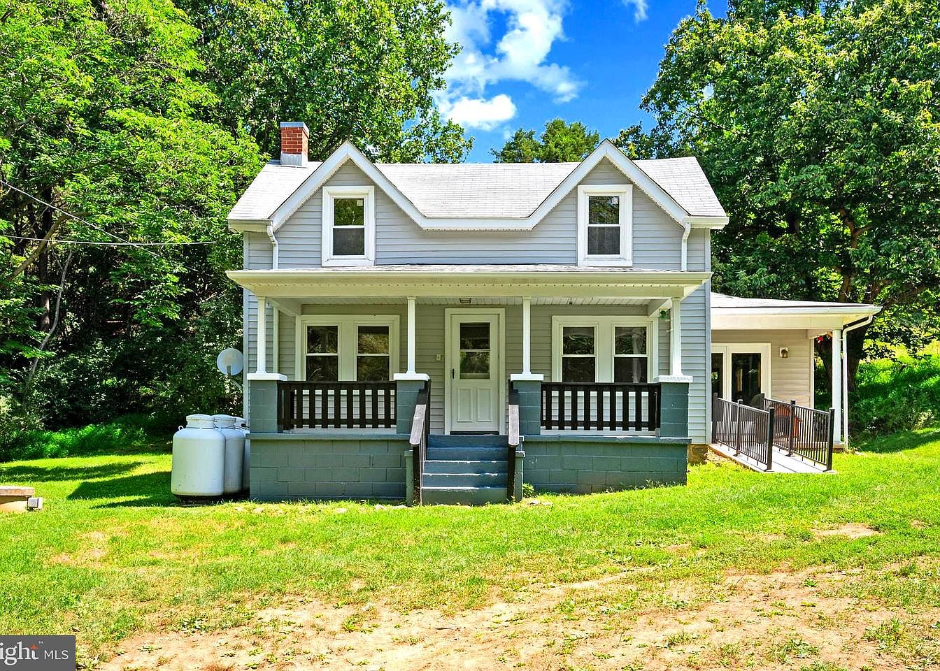 Discover a 1972 two-story home in Stanley, Virginia, featuring a serene ...