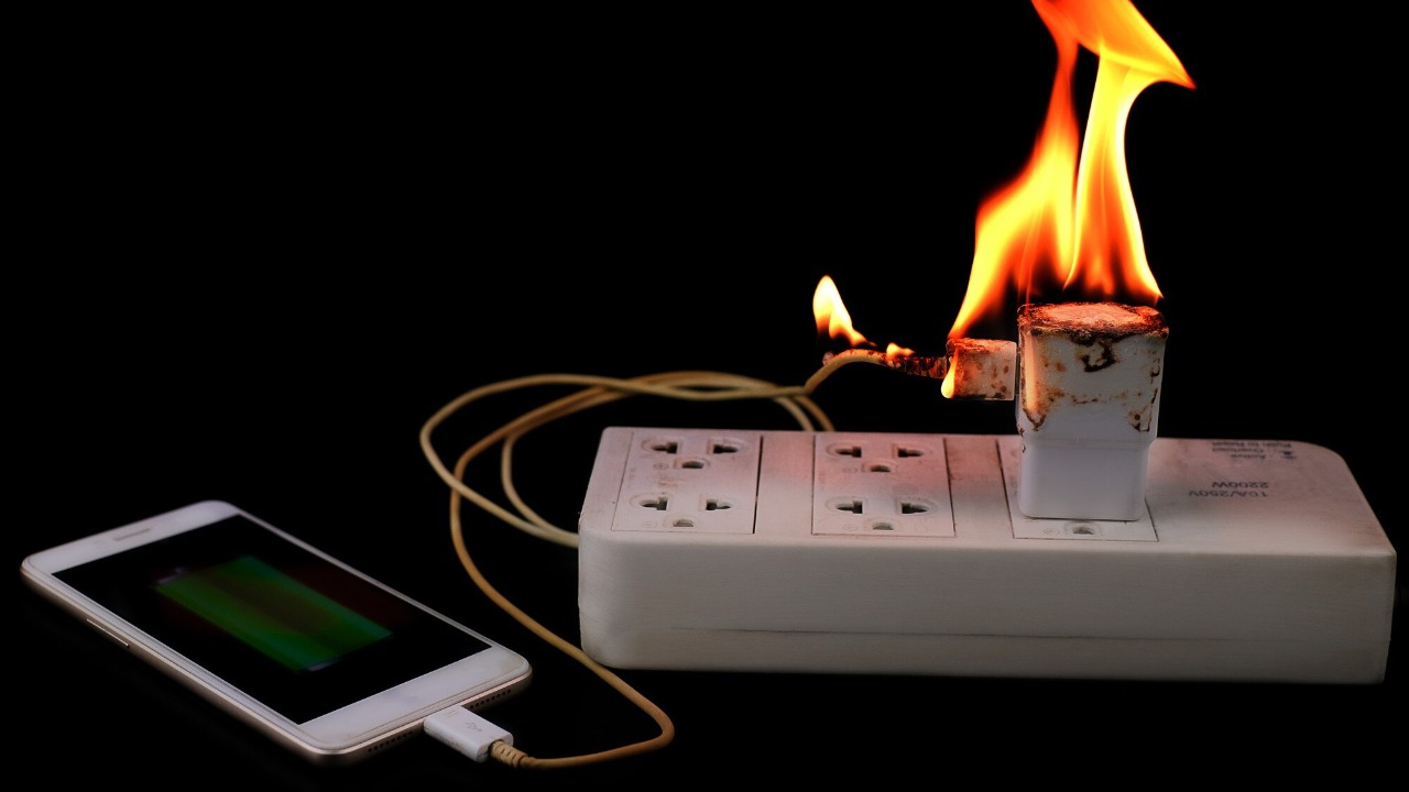 CNET warns overloaded power strips can overheat and spark house fires