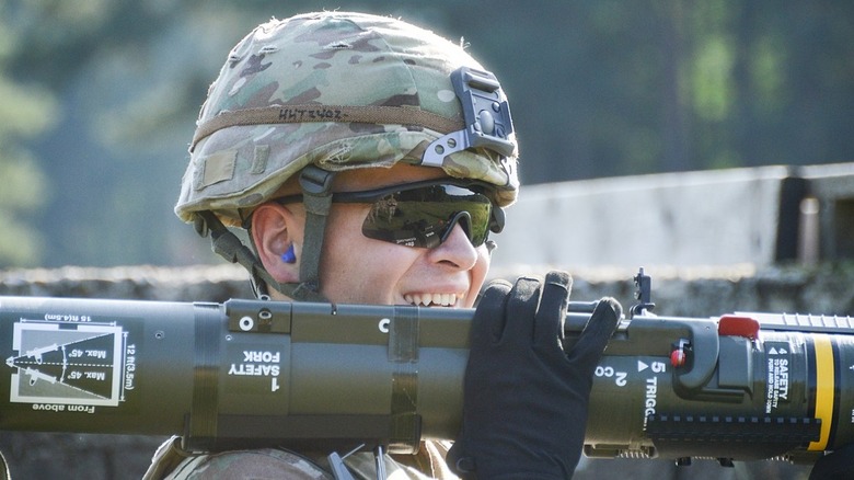 What does Saab mean and what kind of military equipment does it make?