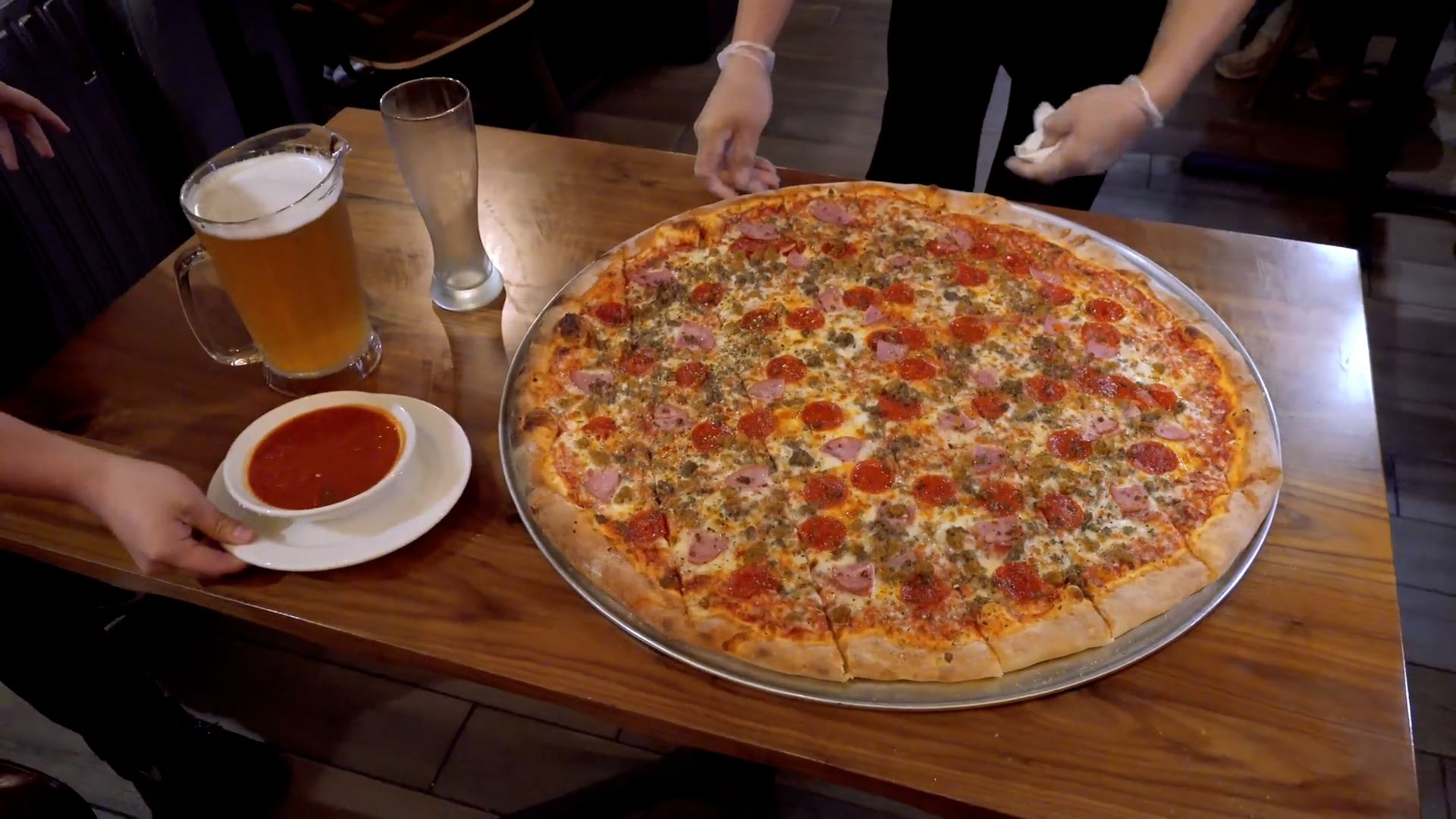 Man attempts impossible 28-inch pizza challenge with full pitcher