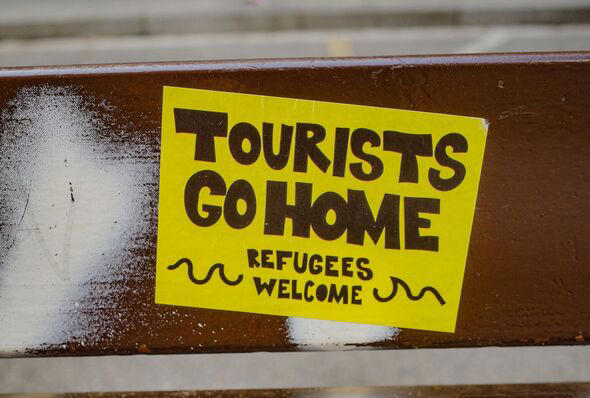 Anti-tourism graffiti appears in travel hotspot loved by Brits as ...