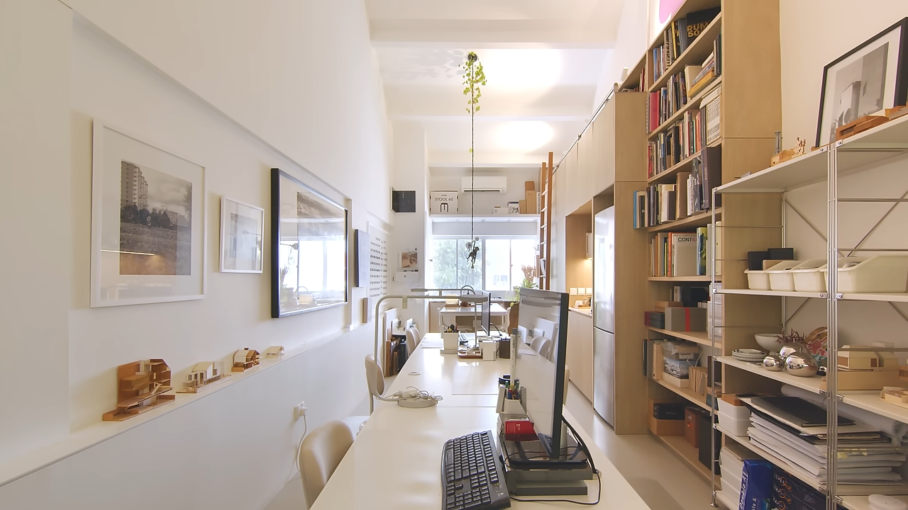Watch this Singapore apartment hide a full work studio – and it works