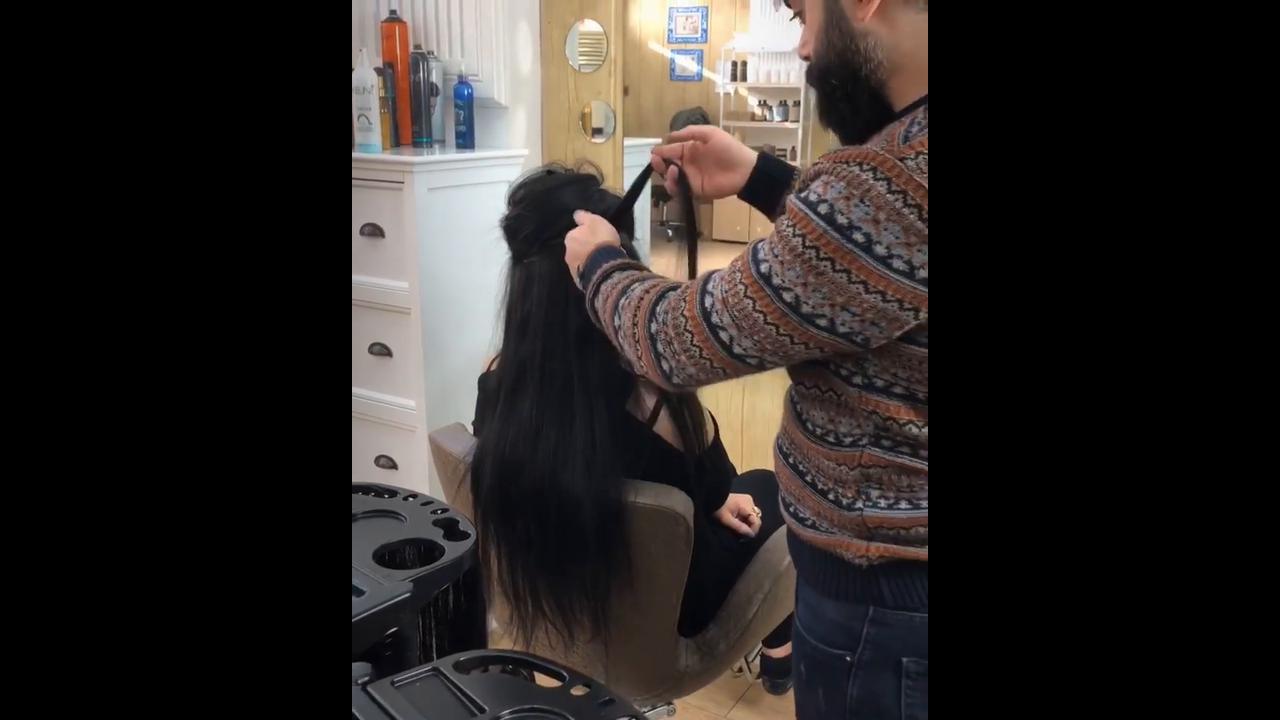 Styling long black hair with straightening technique producing ultra ...
