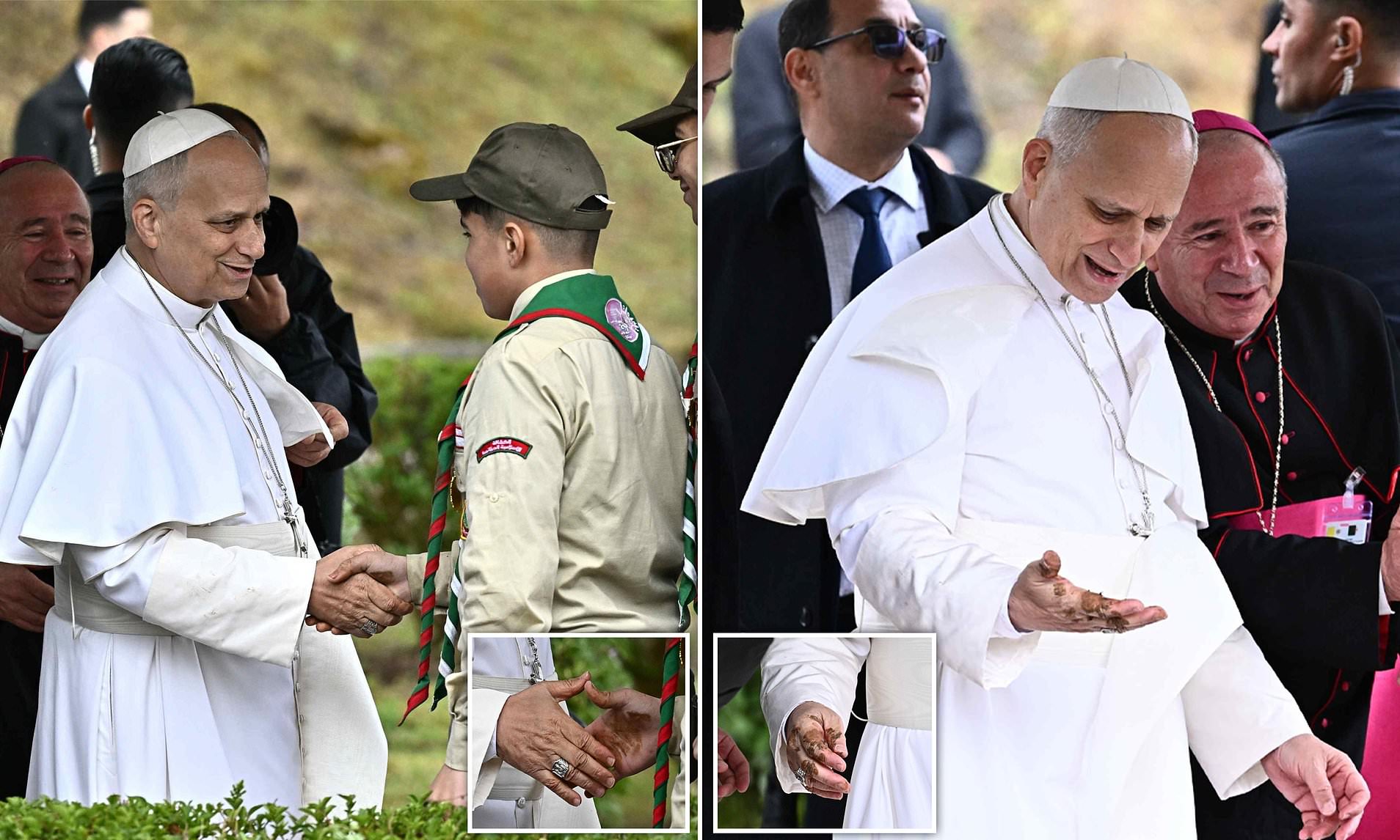 The pong-tiff! Pope looks dismayed after shaking hands with boy scout ...