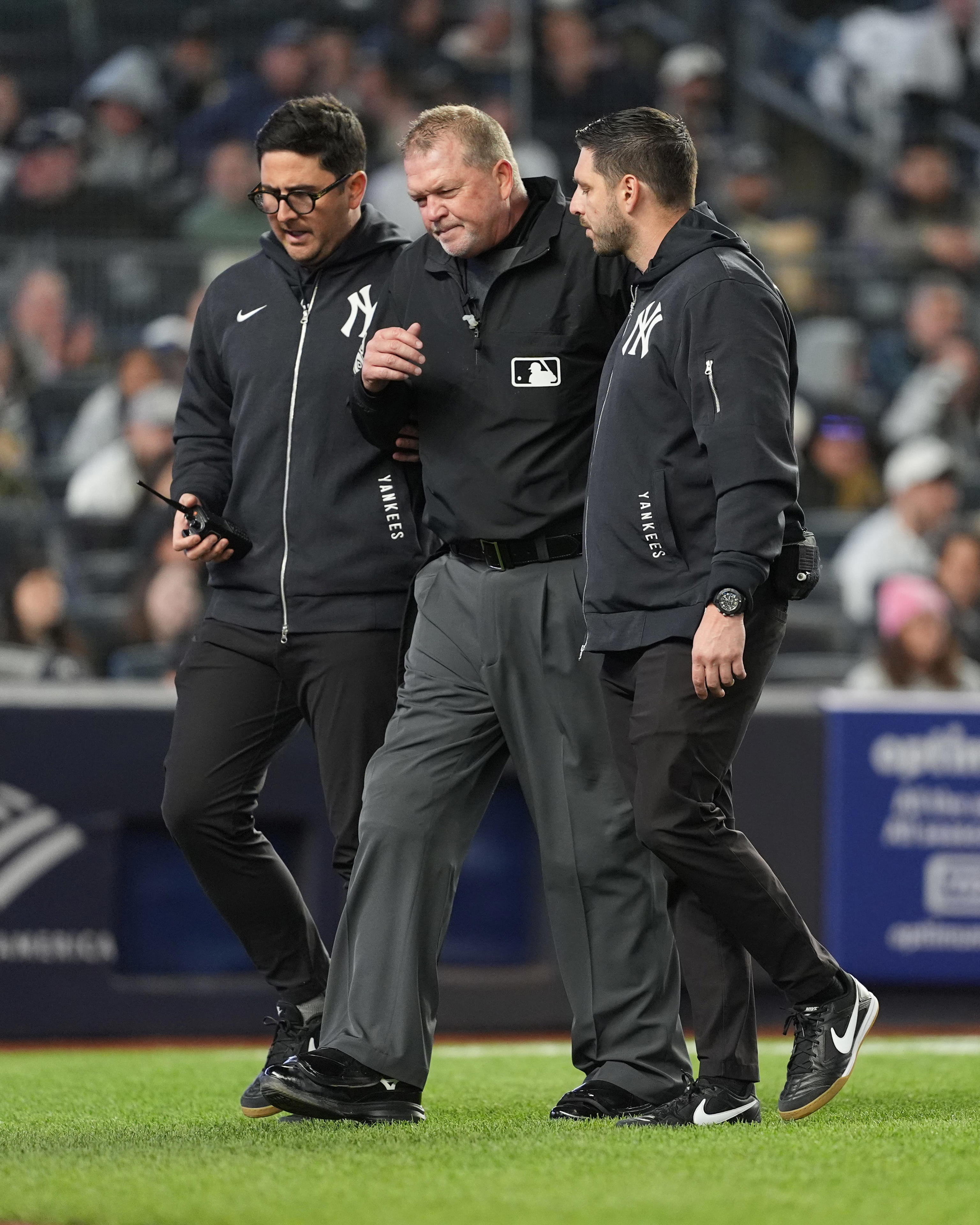 Plate umpire Ron Kulpa exits game at Yankee Stadium