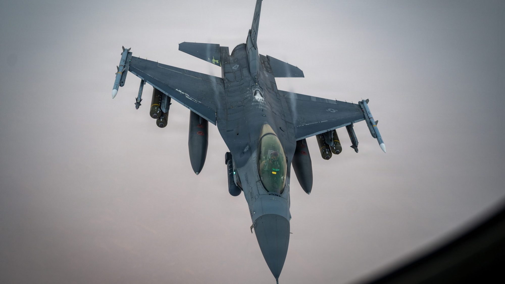 US F-16 shown with mine-dispensing cluster bombs