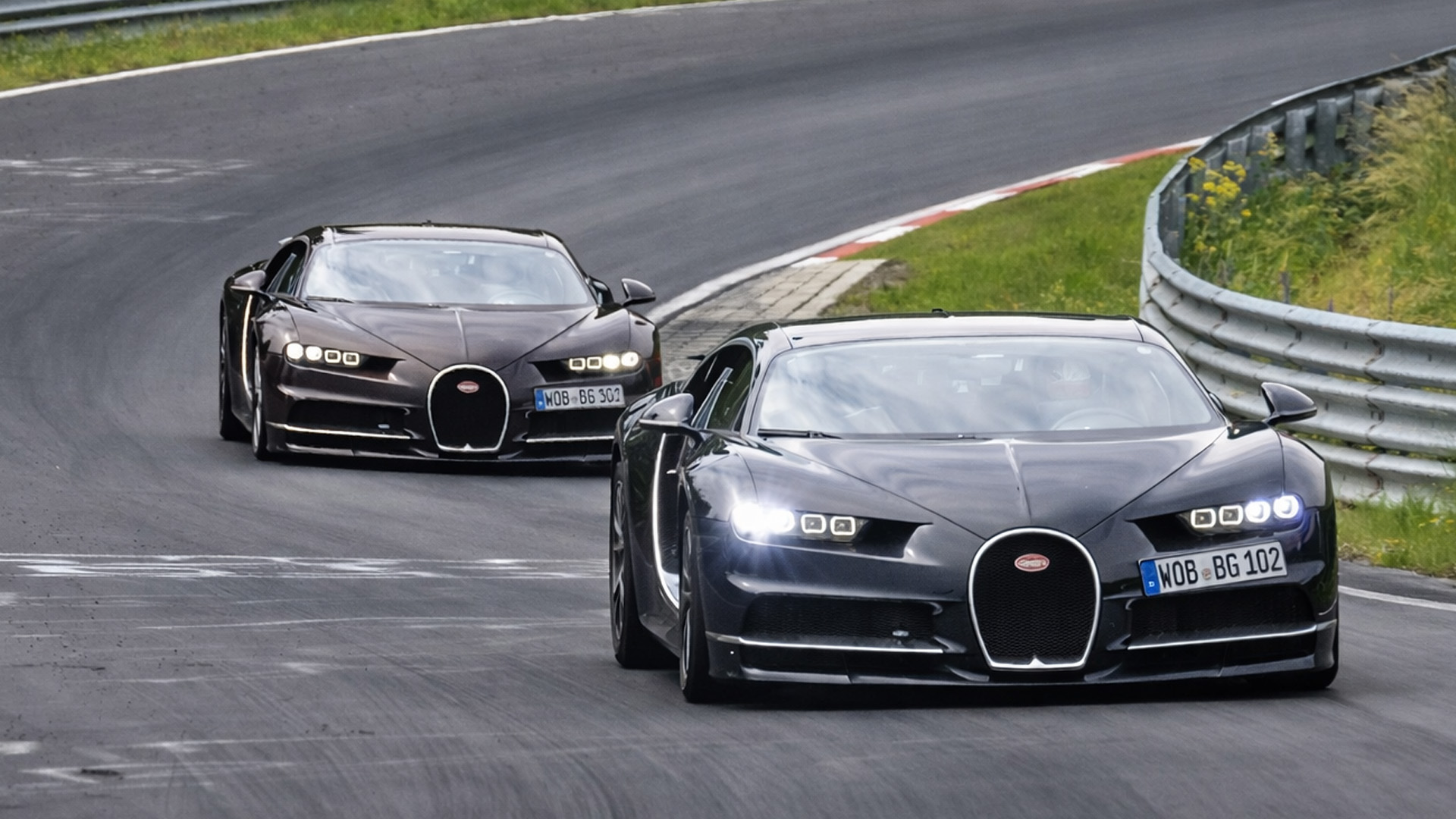 Two Bugatti supercars racing on the Nürburgring track