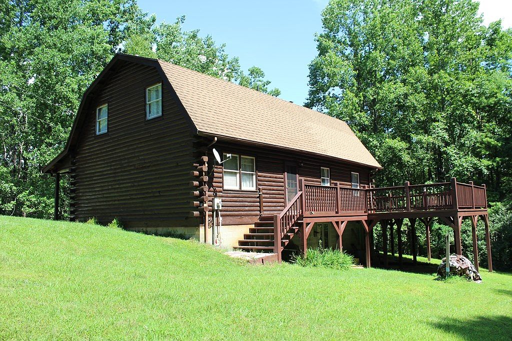 1981 mountain cabin in Fancy Gap, Virginia, featuring a stone fireplace ...