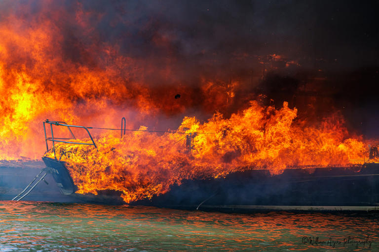 Fire sinks 2 boats and burns dock along Columbia River at Rainier