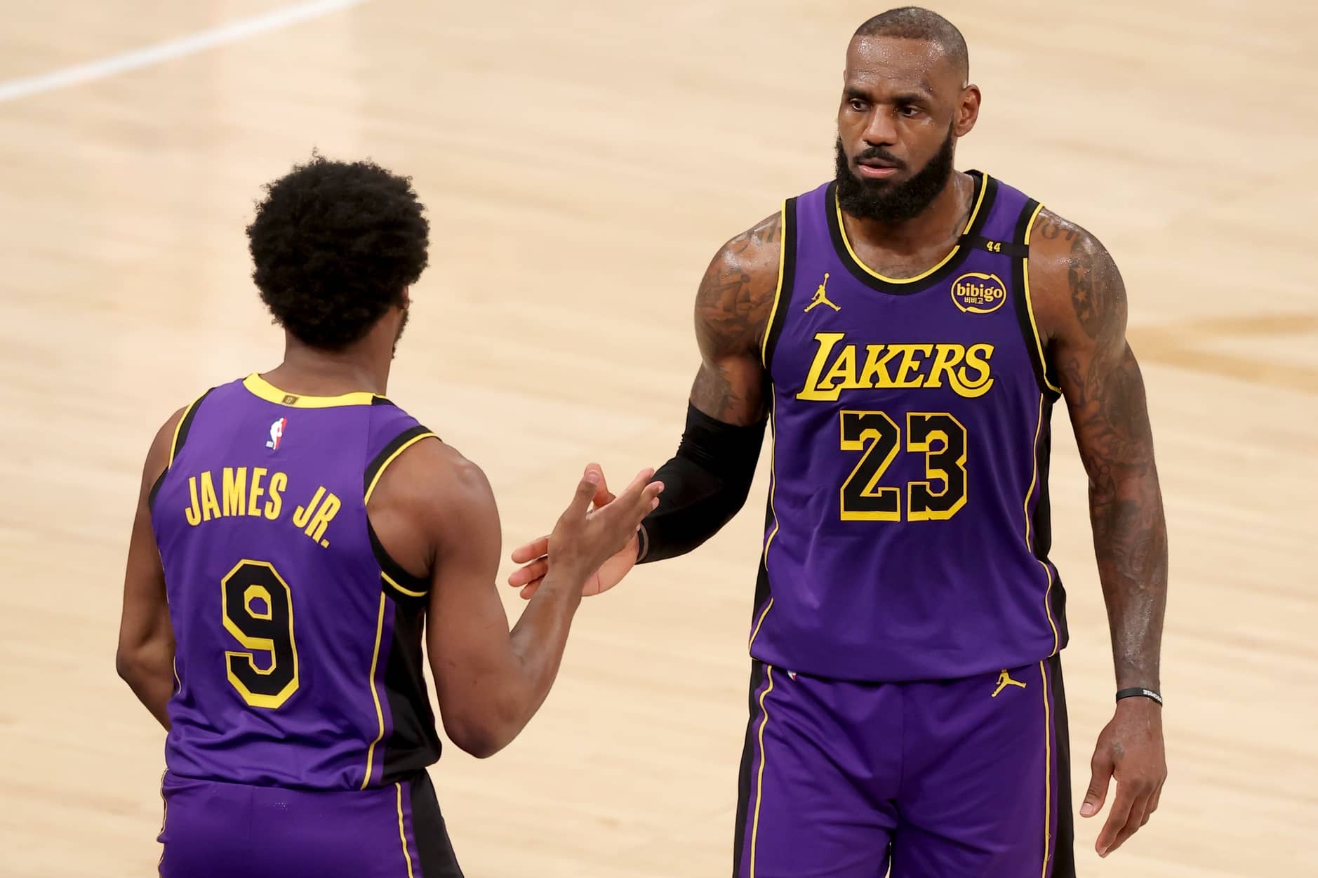 Bronny James reacts after historic alley-oop from LeBron James