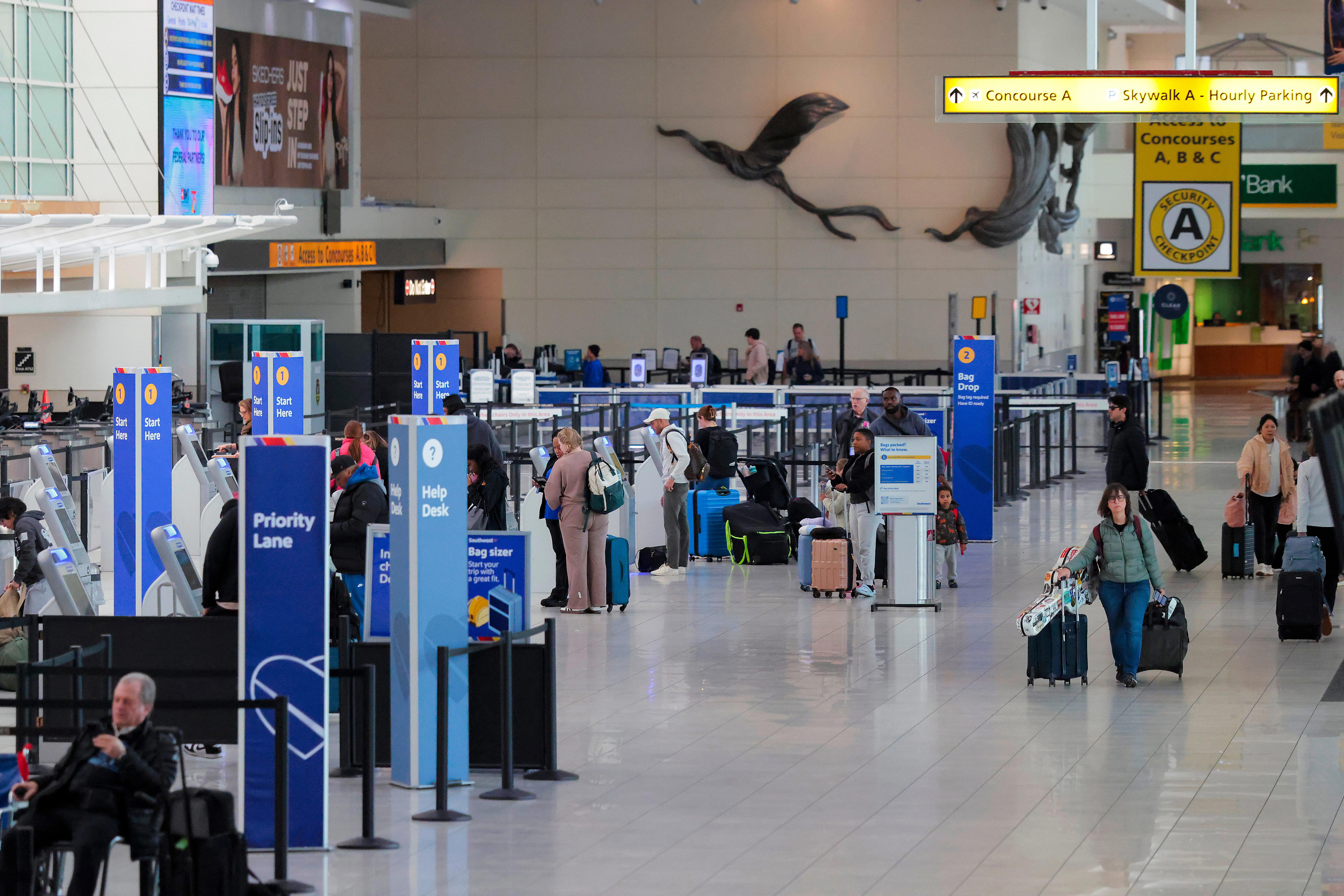 Check TSA wait times at ATL, CLT, IAD, DCA, BWI; DHS shutdown continues