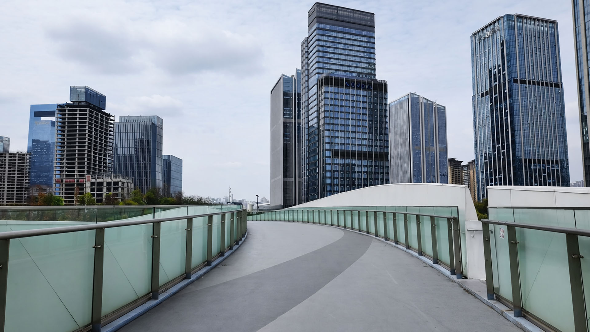 Elevated curved route guides movement through China cityscape towers