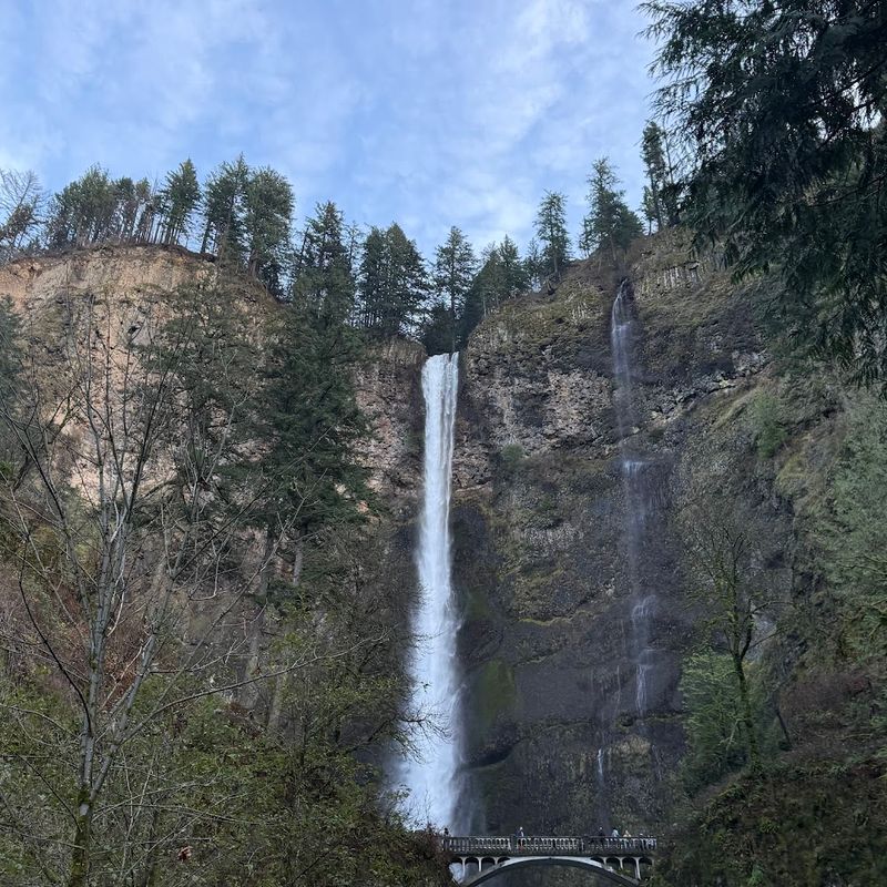 This historic Oregon lodge at the base of a towering waterfall just ...