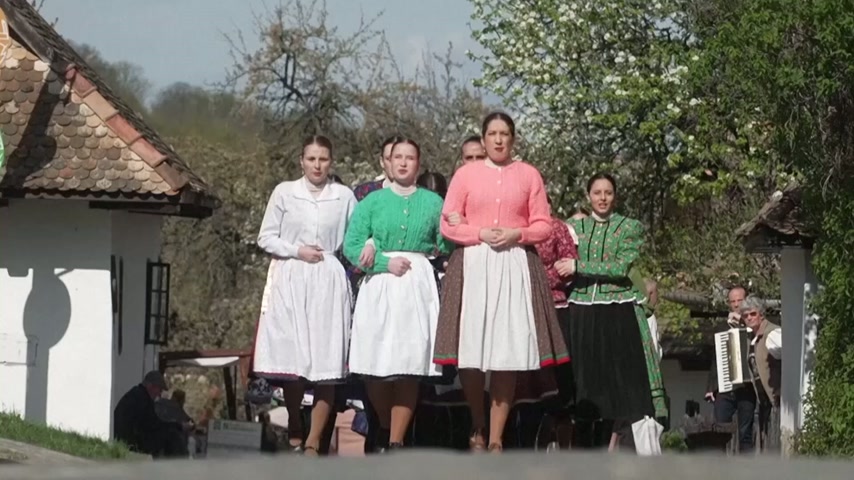 Hungarian Easter tradition sees women doused with water in Hollókő