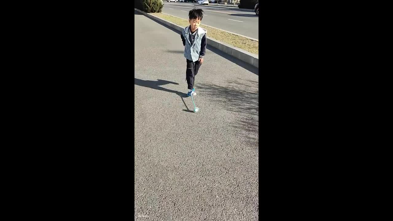 Boy trips while playing ankle skip ball in Liaoning, China