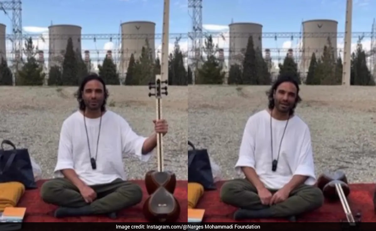 Iranian musician holds sit-in outside Tehran power plant after Trump threat