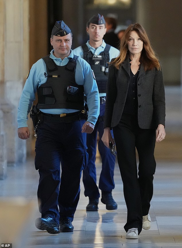 Carla Bruni looks far from her usual glamorous self as she supports ...