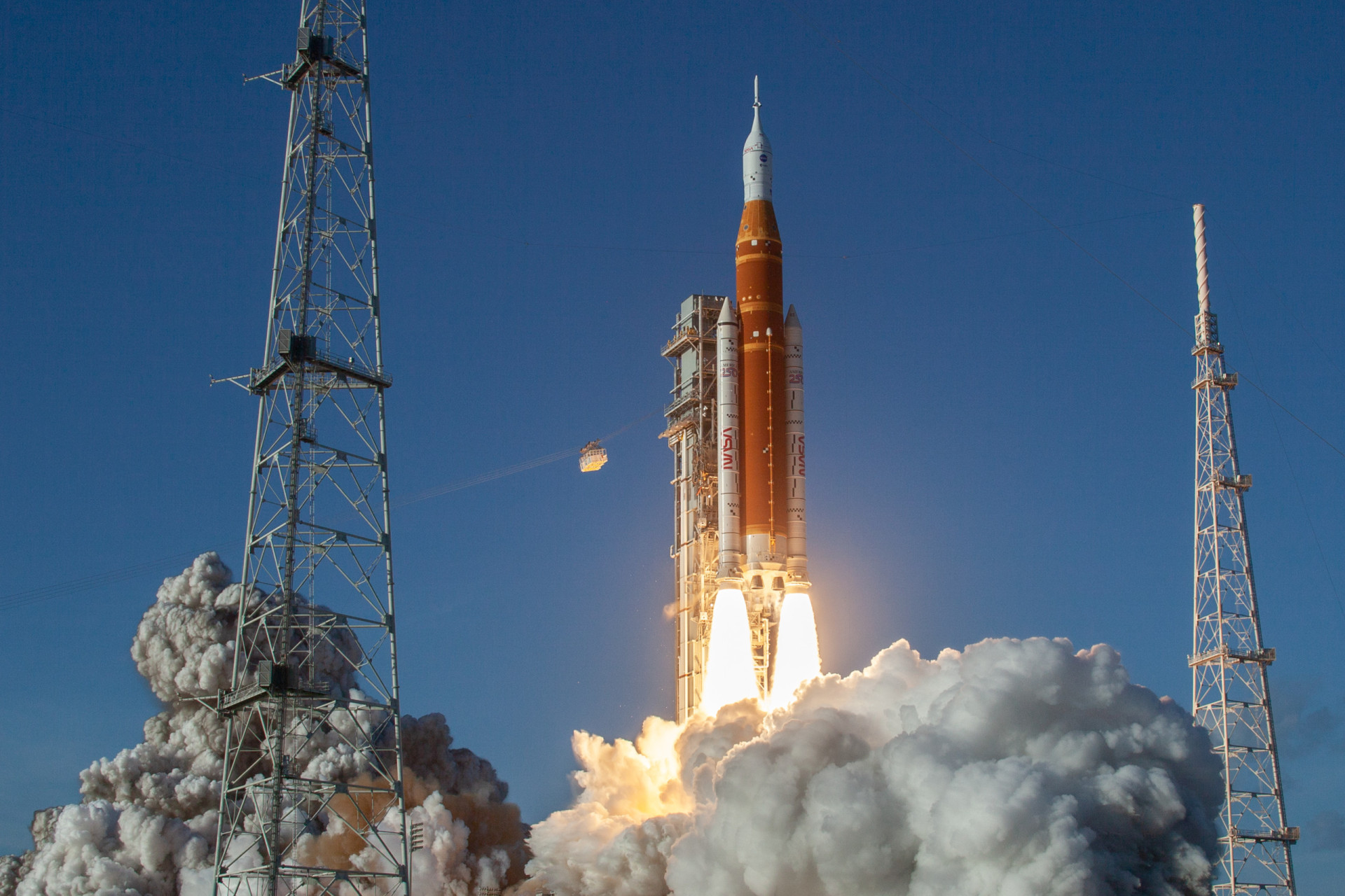 How exactly do you orbit the Earth, and what are the dangers of reentry?