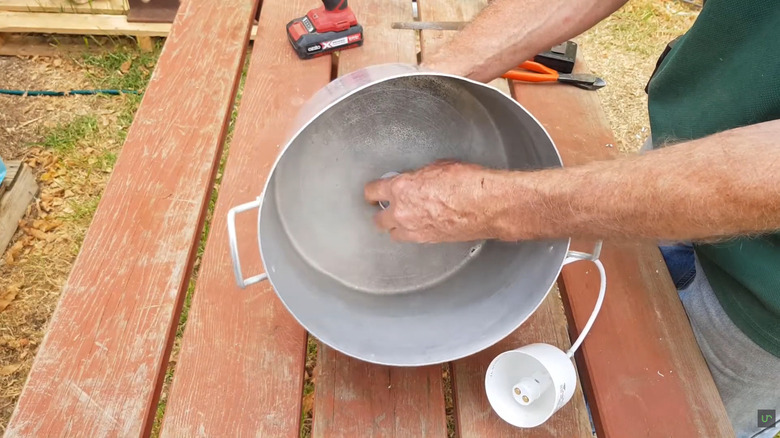 Light up your indoor space with this creative DIY using an old cooking pot