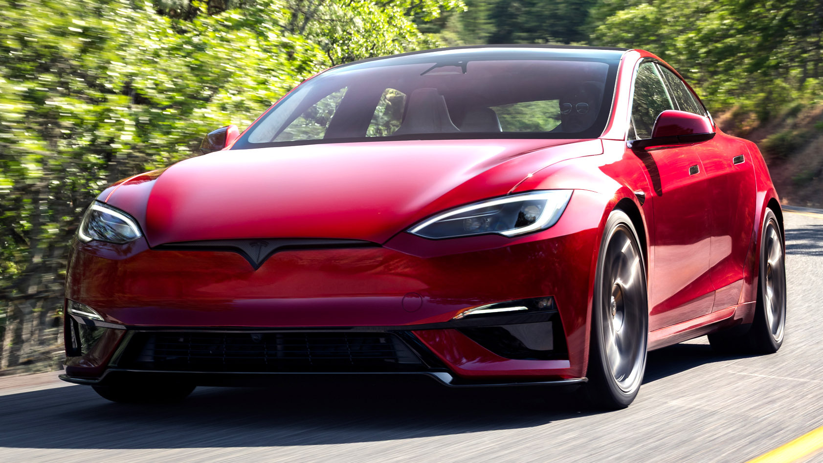 Most automakers clear inventory with discounts. Tesla raised Model S ...