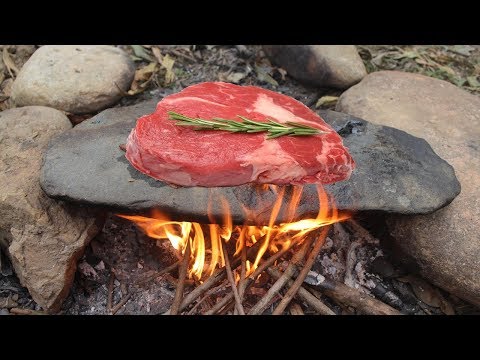 Primitive cooking on a hot rock
