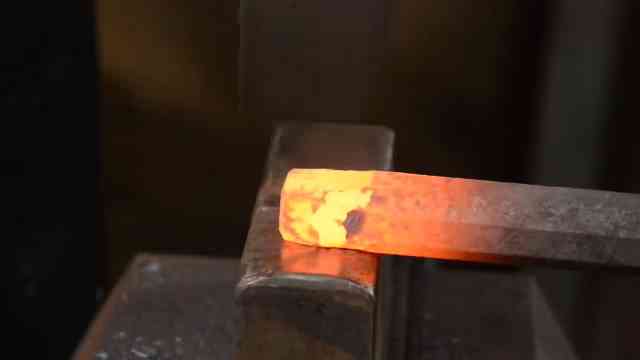 A blacksmith forges the tools used for splitting stone