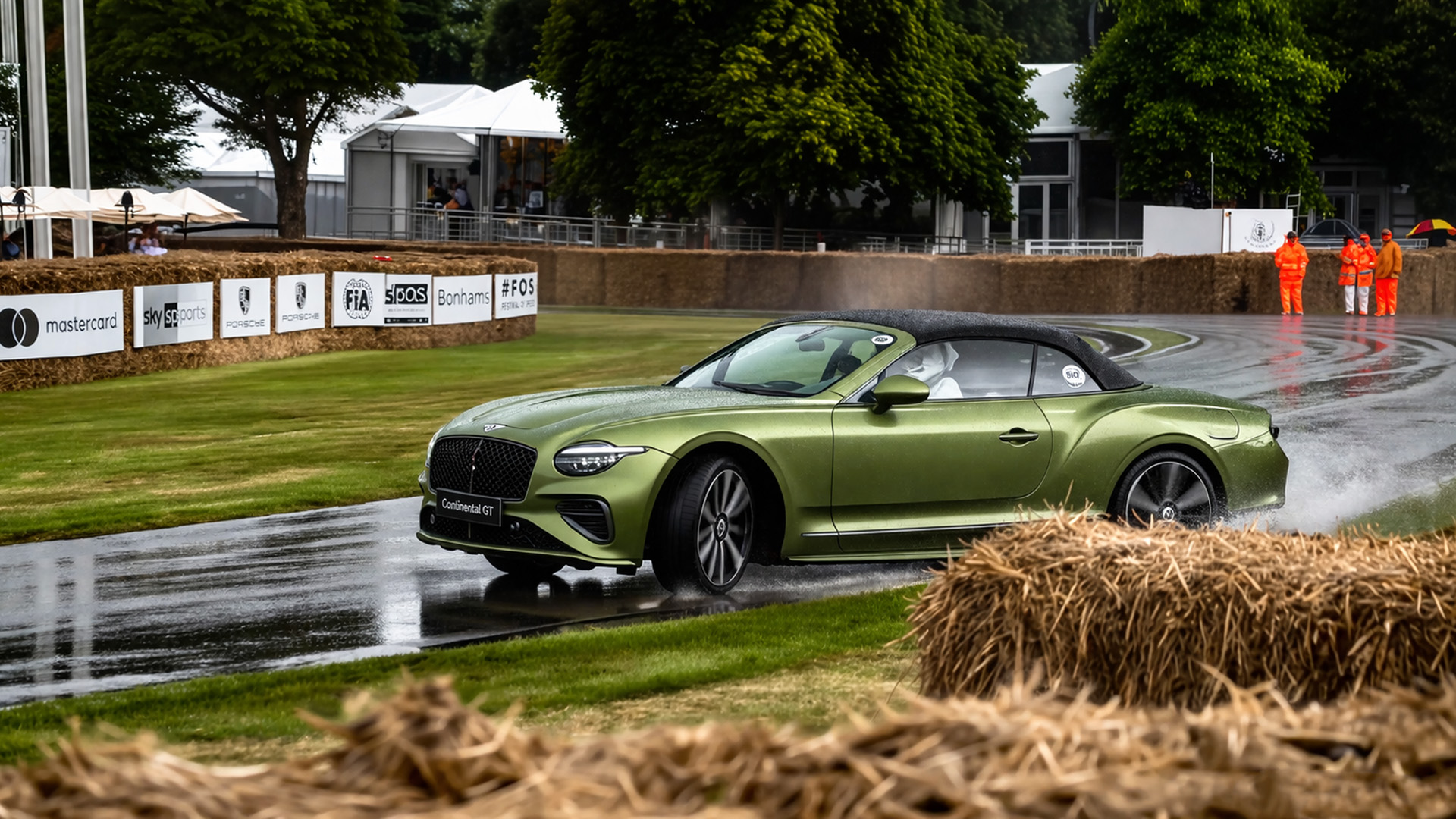 Bentley Continental GT slips at high speed on wet track corner