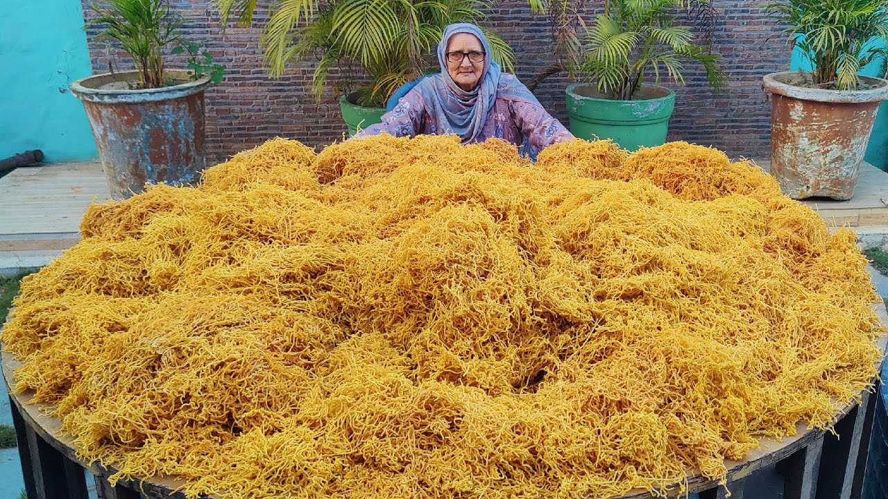 Indian granny making mega portion of snack for the kids