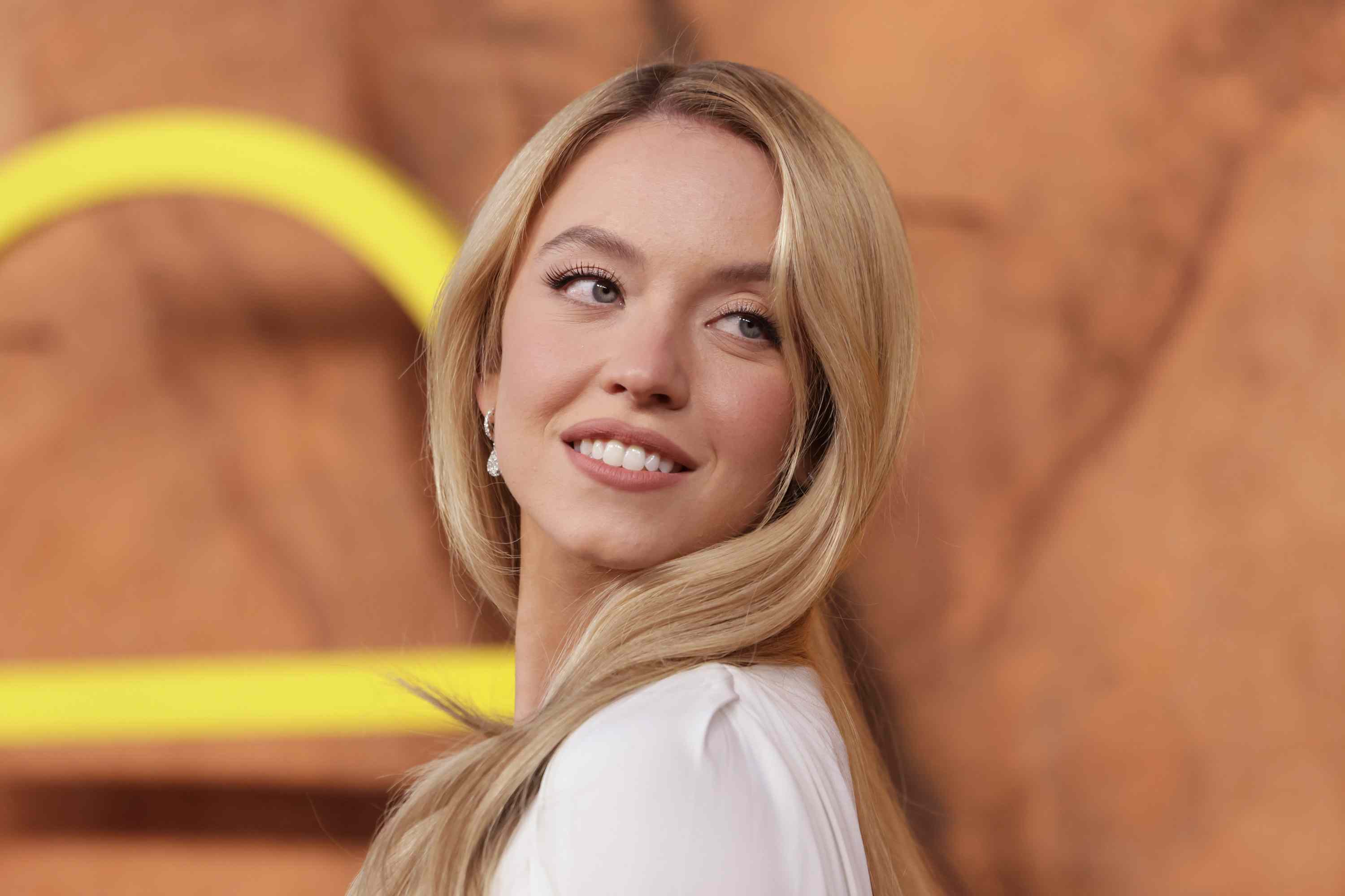 Sydney Sweeney's all-white high-low dress has an unexpected coquette ...