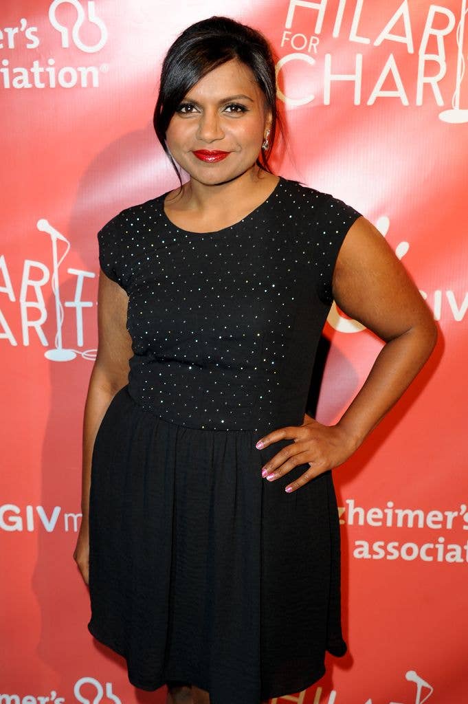 Mindy Kaling highlights tiny waist in glittery gold gown after 40lbs ...