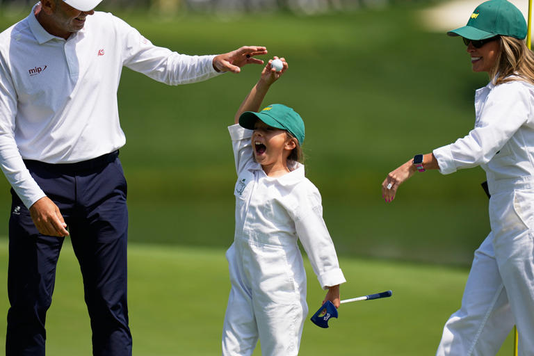 Photos of golfers and their children enjoying the Par-3 contest at the ...