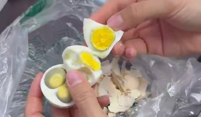Woman discovers rare triple-yolk egg while preparing food at home