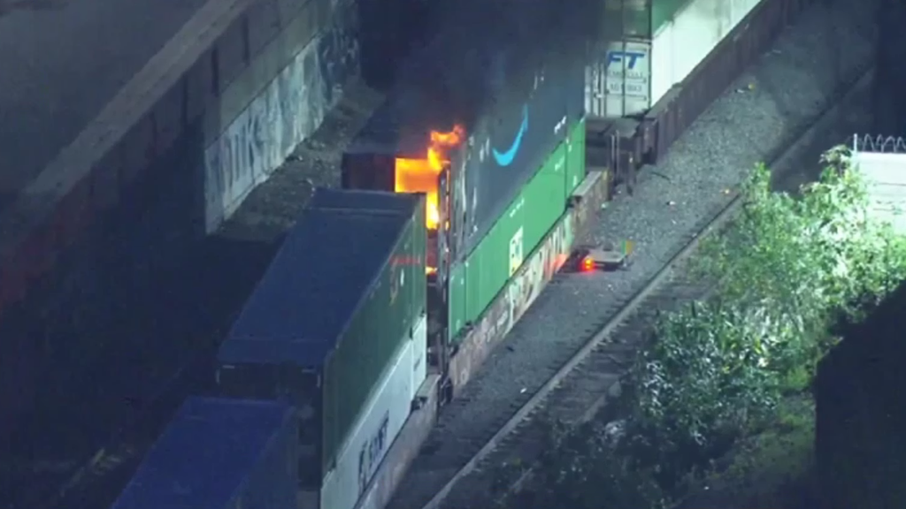 Amazon cargo container catches fire on moving train in downtown Los Angeles